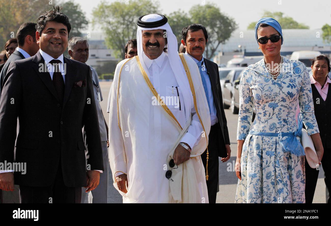 Qatar's Emir Sheikh Hamad bin Khalifa Al Thani, center, and his wife Sheikha Moza bint Nasser Al ...