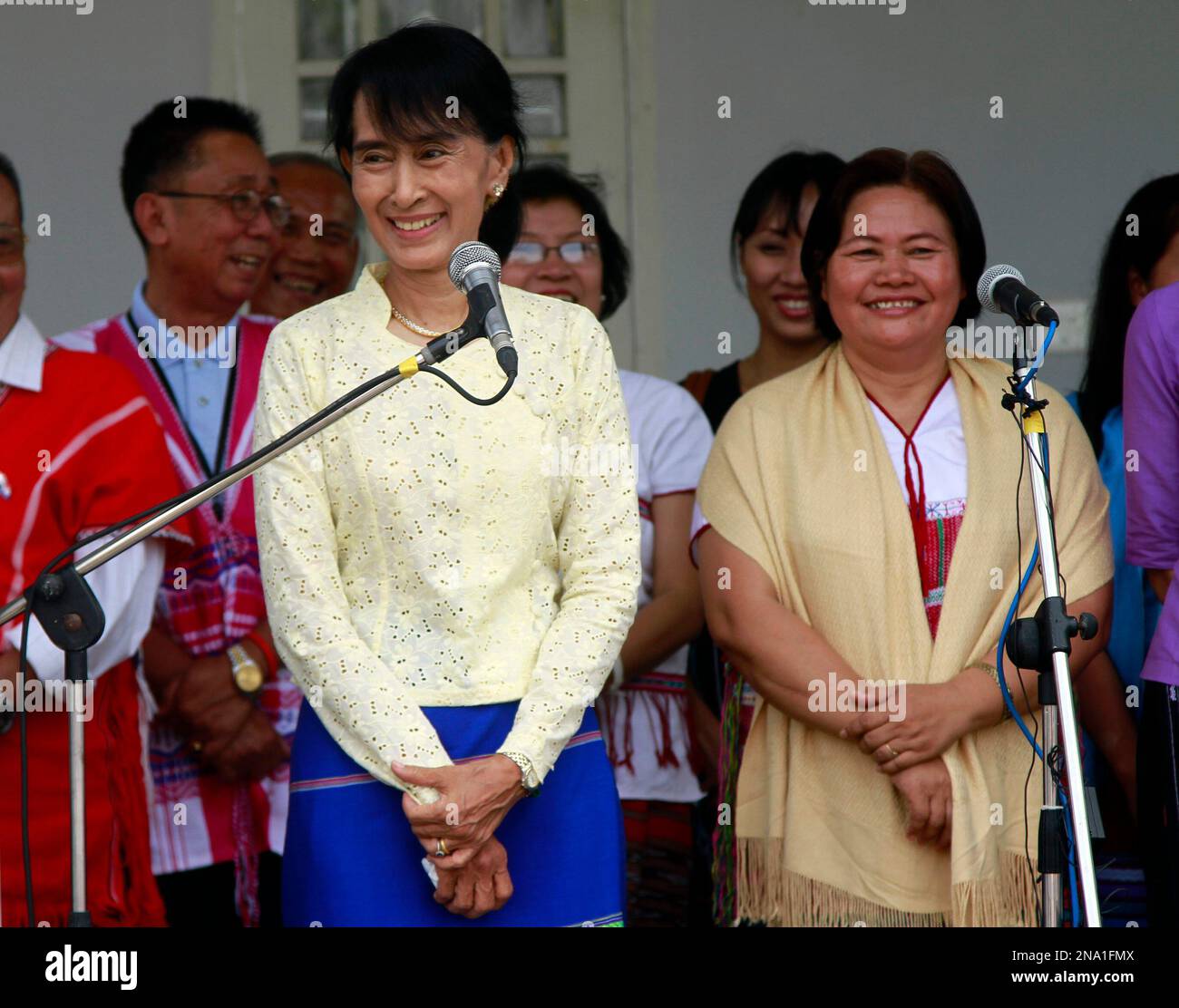 Myanmar's pro-democracy leader Aung San Suu Kyi, left, smile during a press conference after ...