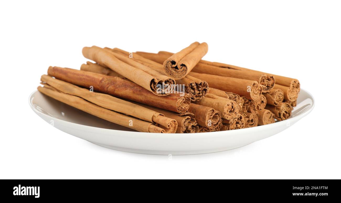 Aromatic dry cinnamon sticks on white background Stock Photo - Alamy