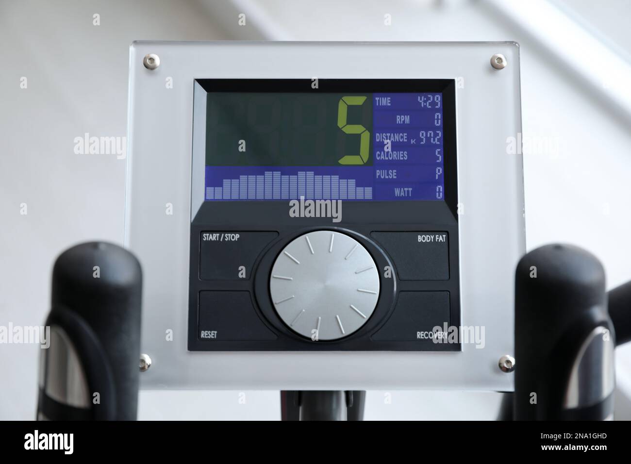 Control panel of modern elliptical machine cross trainer on blurred ...