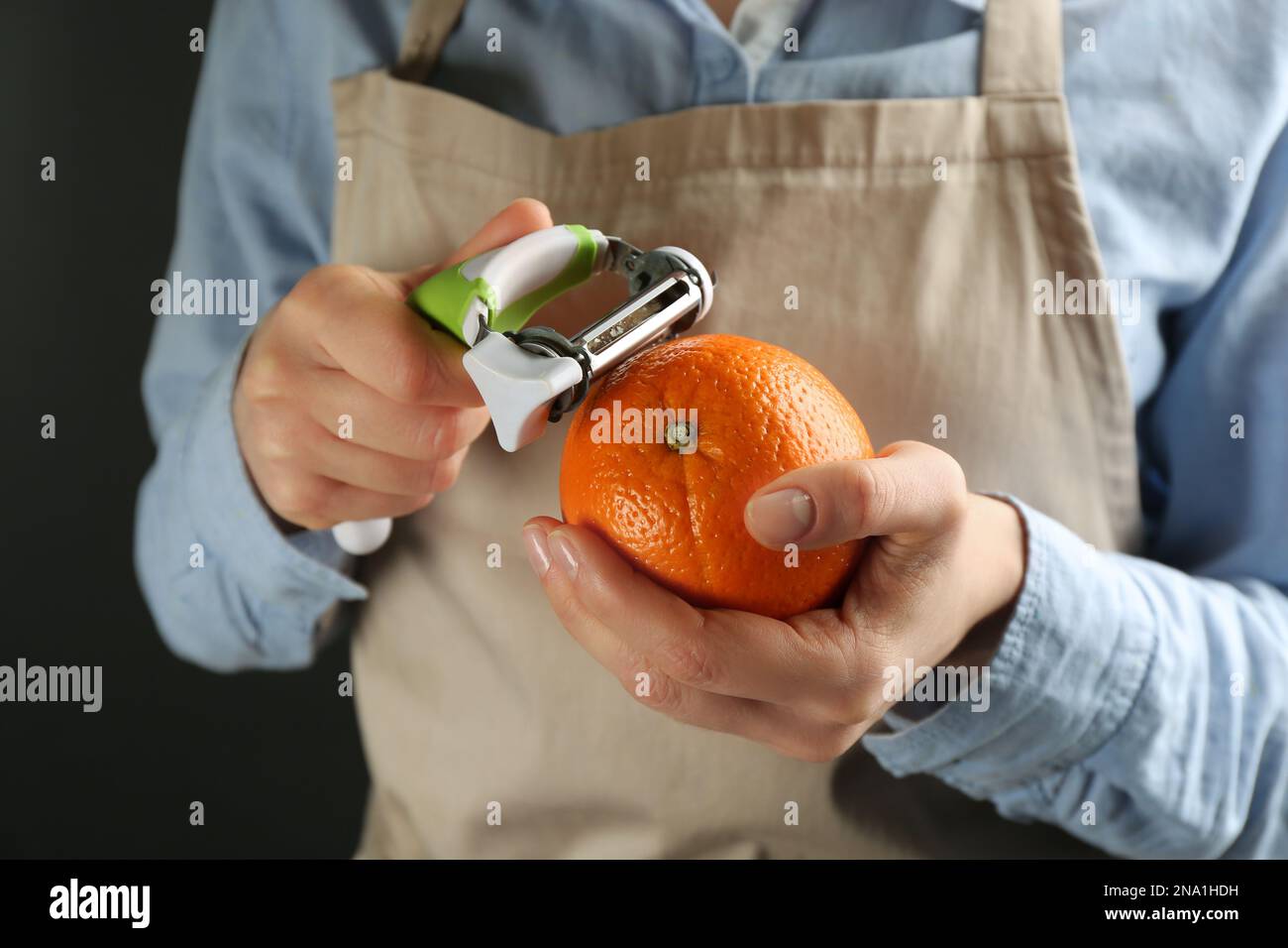 Female hands peeling orange hi-res stock photography and images - Alamy