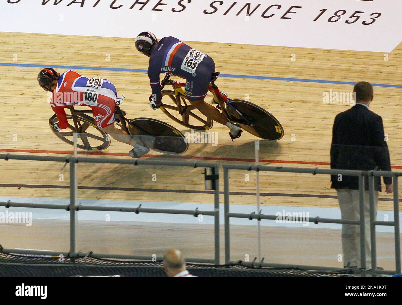 Britain's Jason Kenny, bottom, leaves his line and blocks France's ...