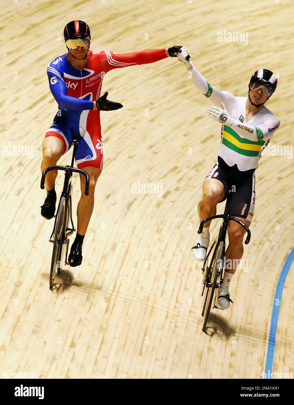 Britain's Chris Hoy, left, and Australia's Shane Perkins shake hands ...