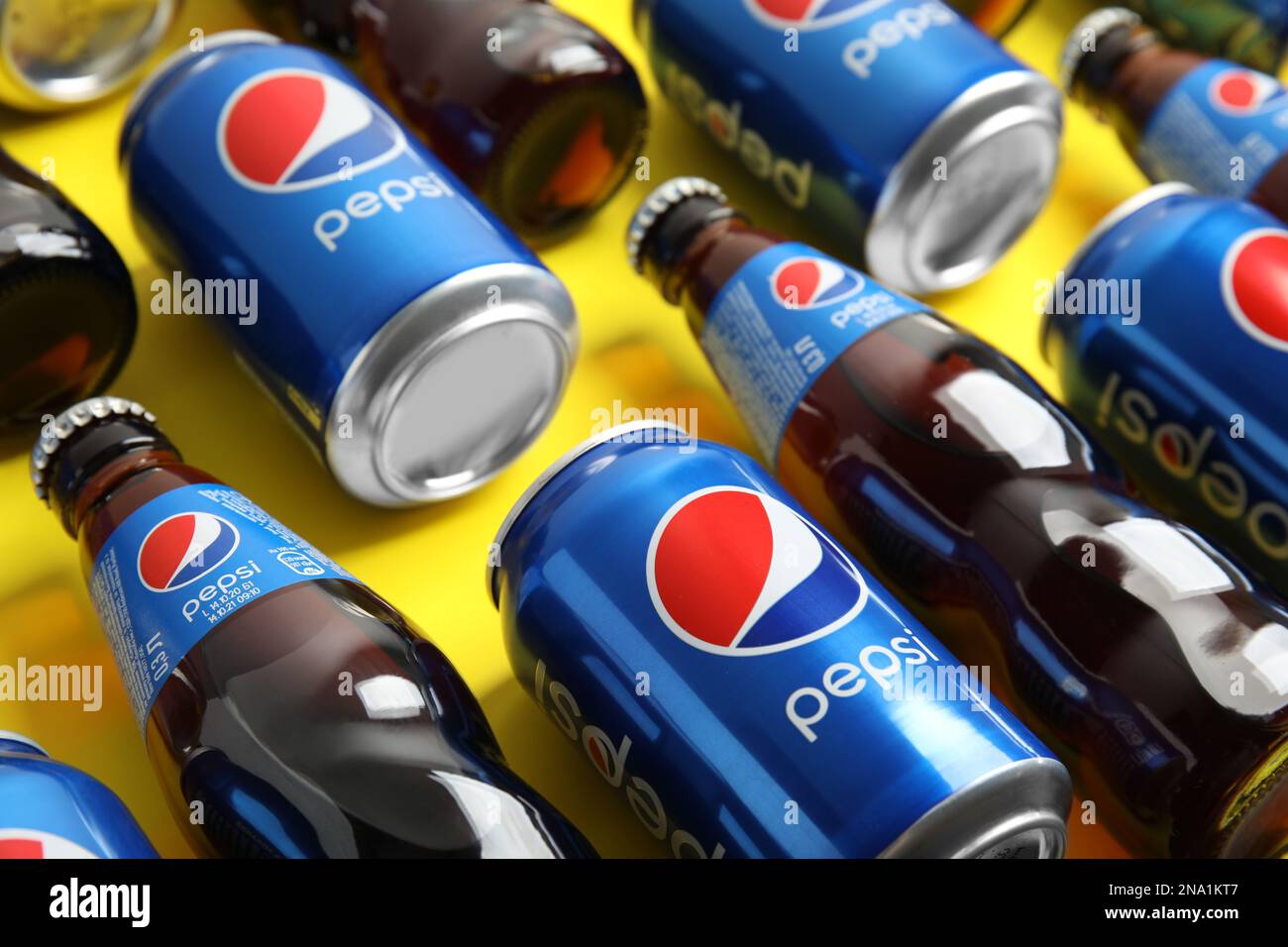 MYKOLAIV, UKRAINE - FEBRUARY 9, 2021: Many bottles and cans of Pepsi on ...