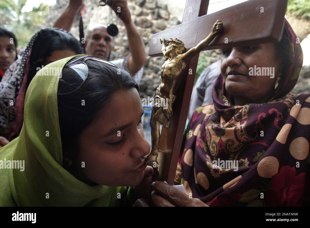 Pakistani Christians attend a Mass on Good Friday in a church in Lahore ...