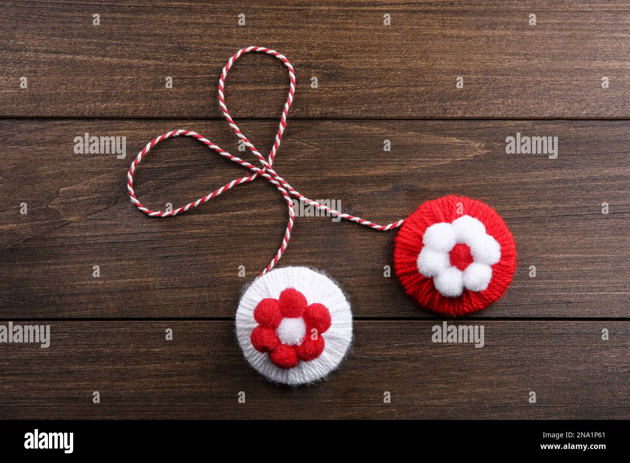 Traditional martisor with flowers on wooden background, top view ...