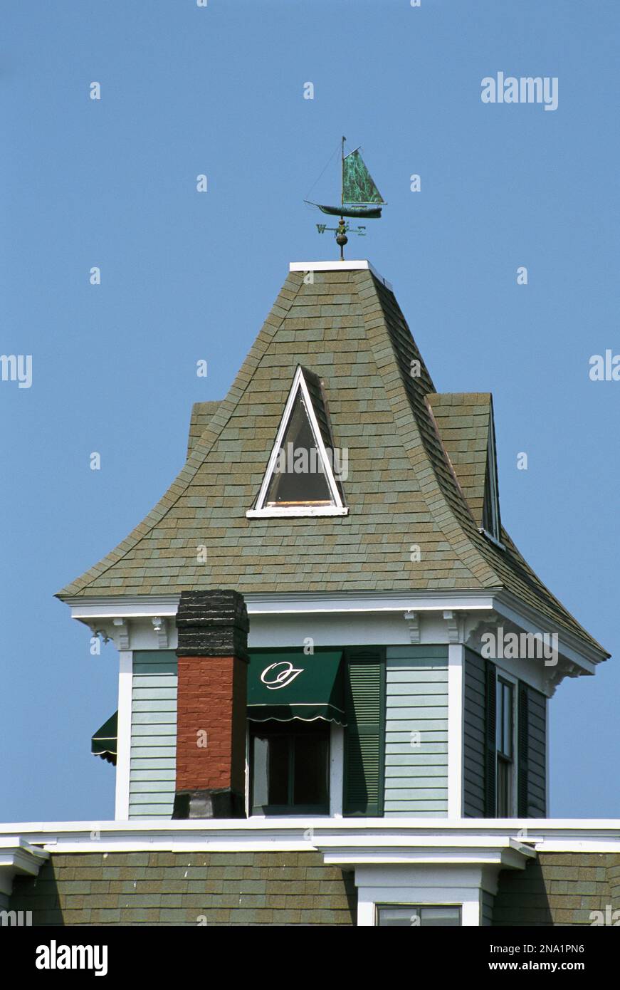 A sailboat-shaped weather vane atop the Orleans Inn.; Orleans, Cape Cod ...