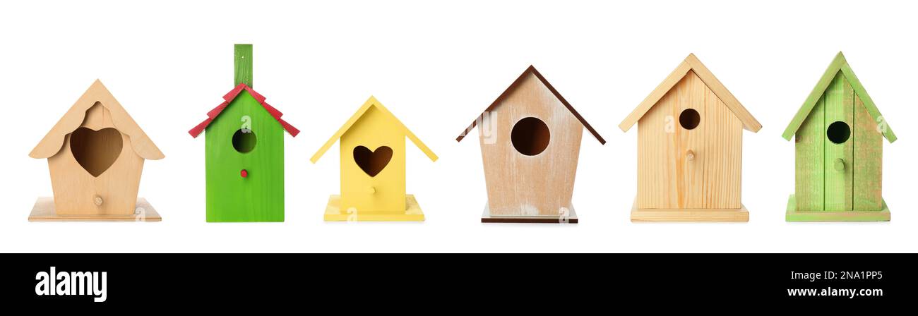 Set with different beautiful bird houses on white background, banner ...
