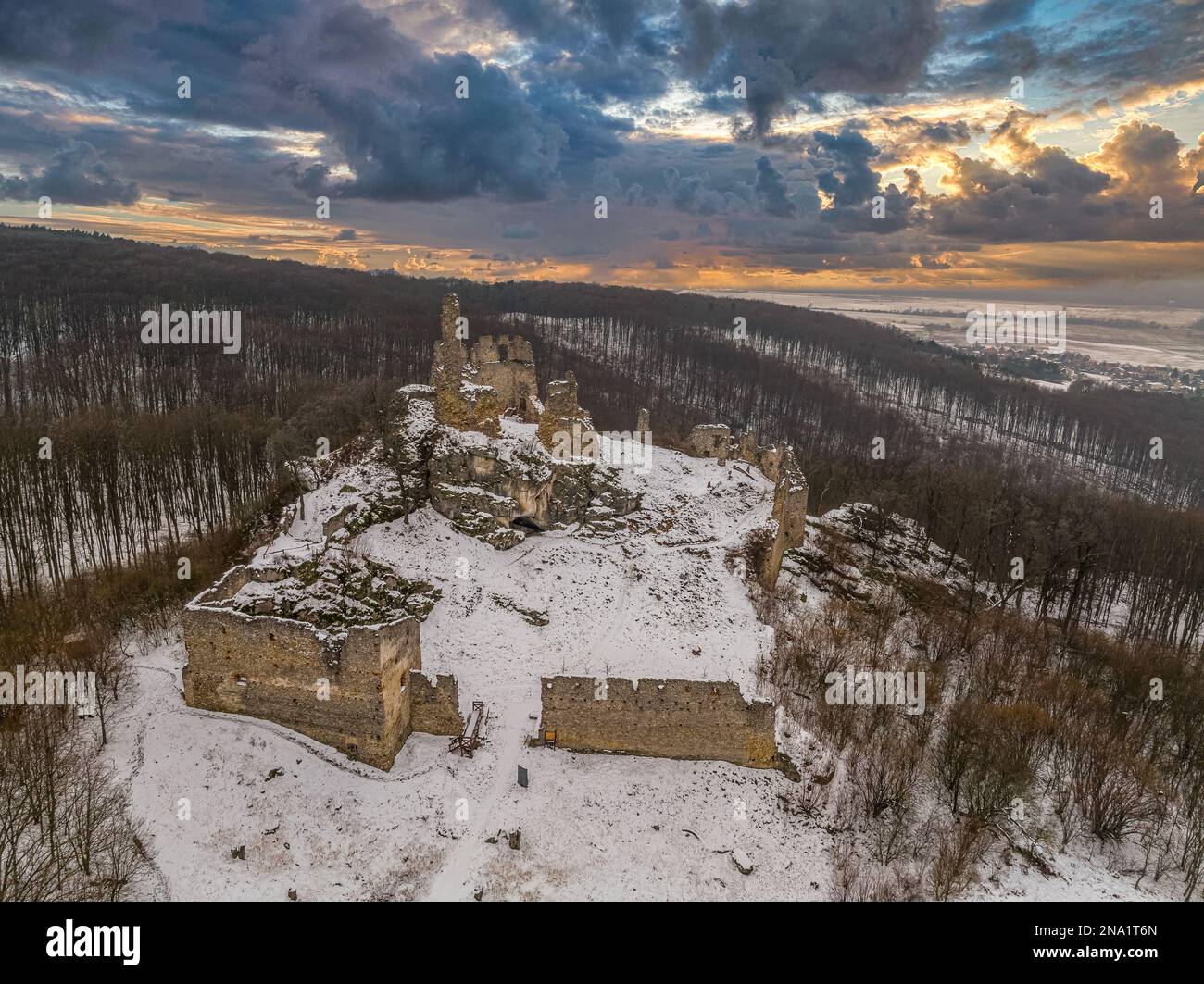 Dramatic sunset over winter Korlatka castle in the little Carpathian ...