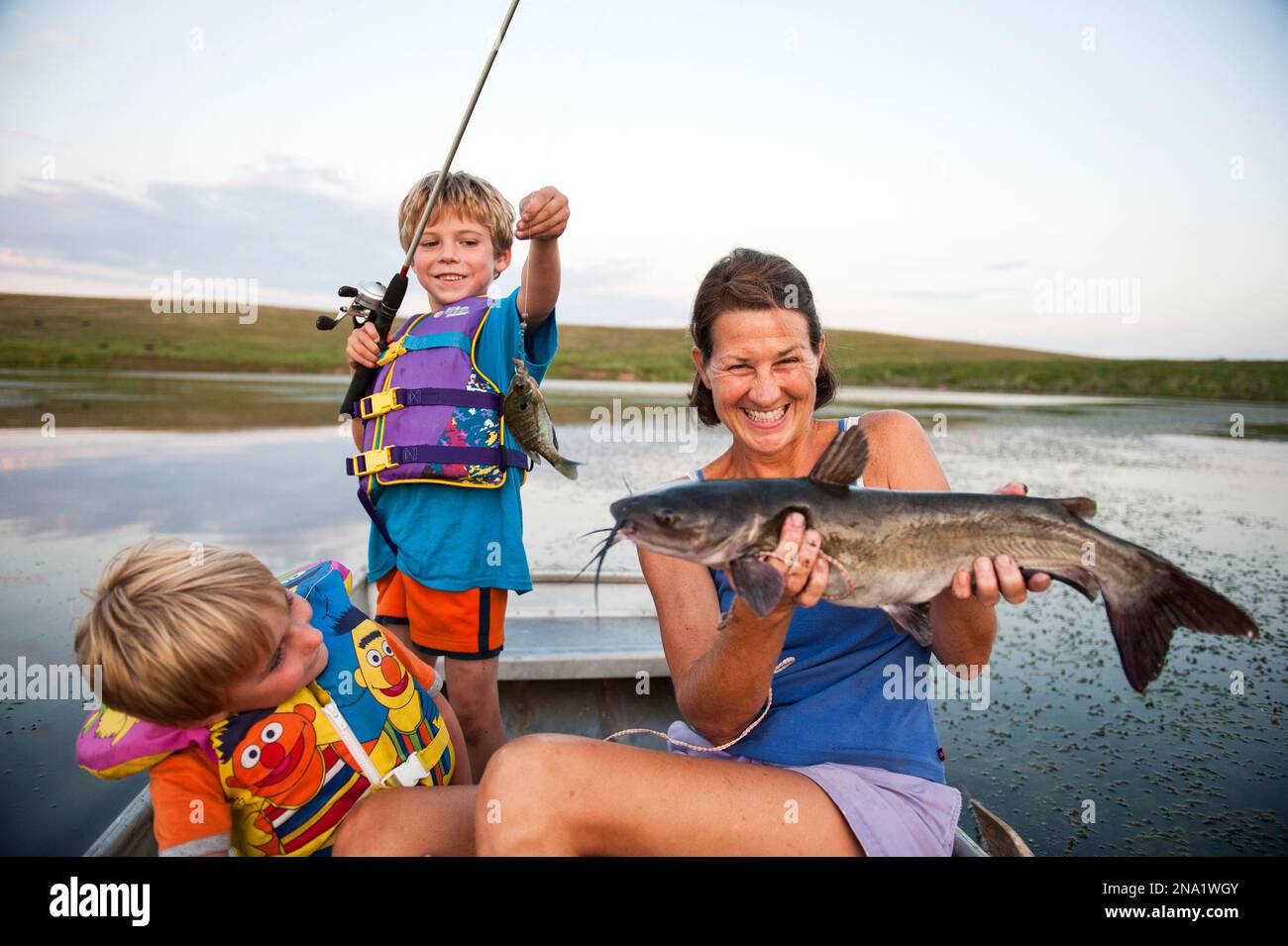 Mother and two young sons go fishing and catch fish; Valparaiso ...