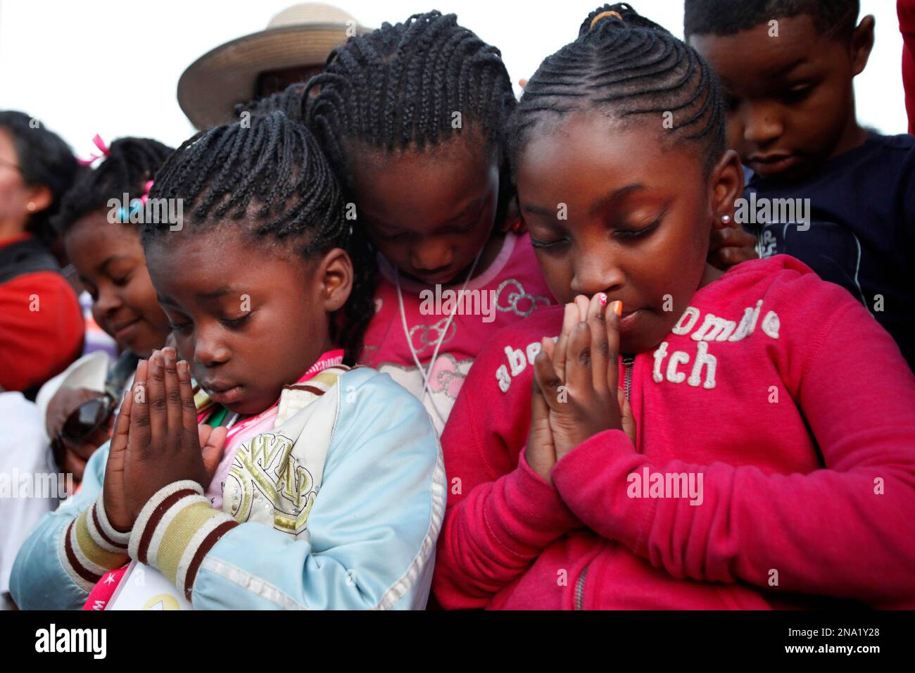 Azariah Usher, 6, left, Shakera Smith, 10, and Camaya Newton, 7, all of ...