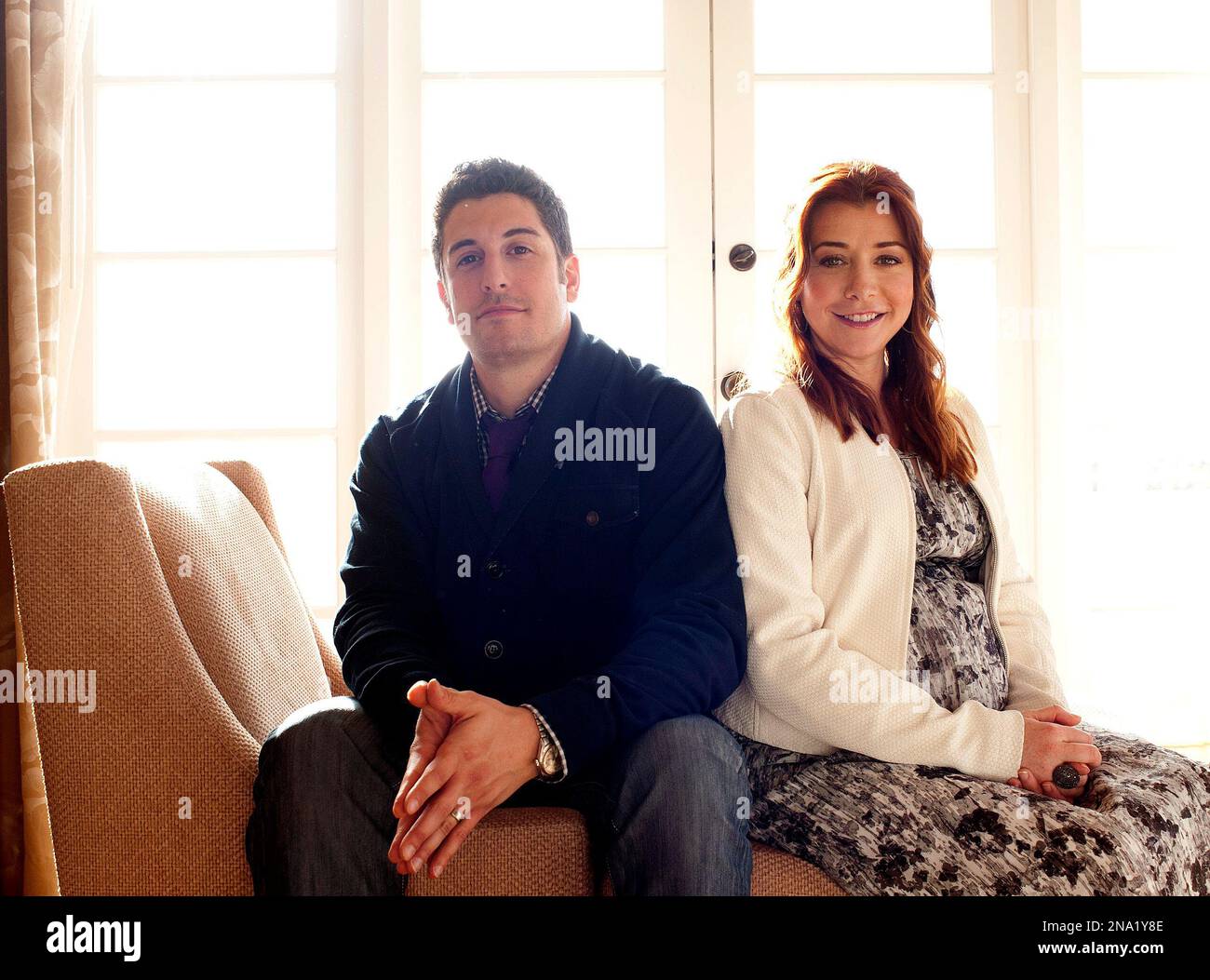 In this March 18, 2012 photo, actors Jason Biggs, left, and Alyson ...