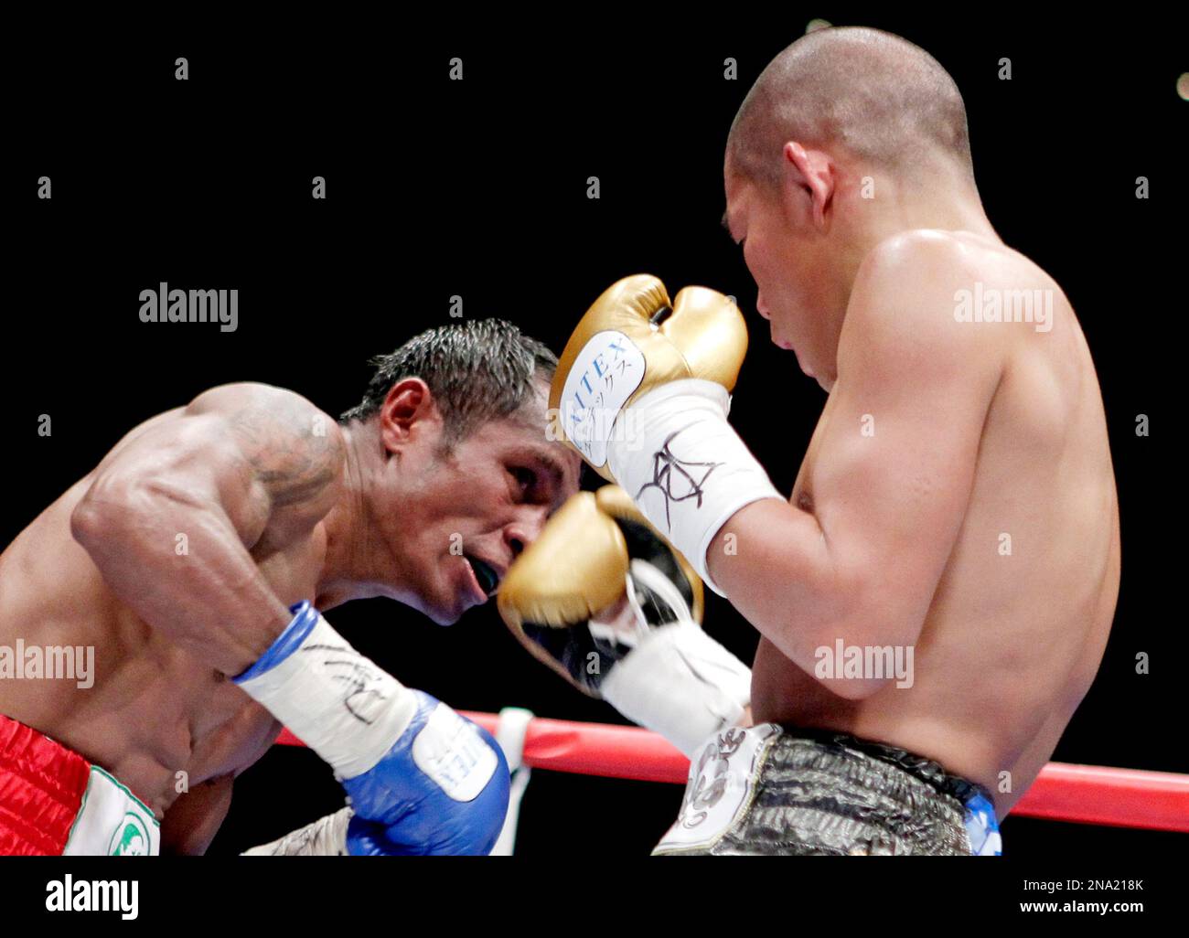 Japan's Koki Kameda, right, lands a right to Indonesia's Noudly ...