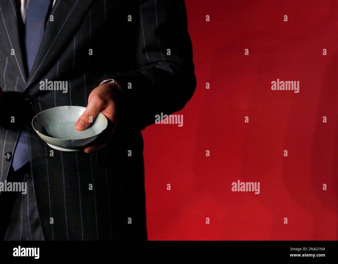 Nicolas Chow, Sotheby’s Asia Deputy Chairman, holds the Chinese Song ...