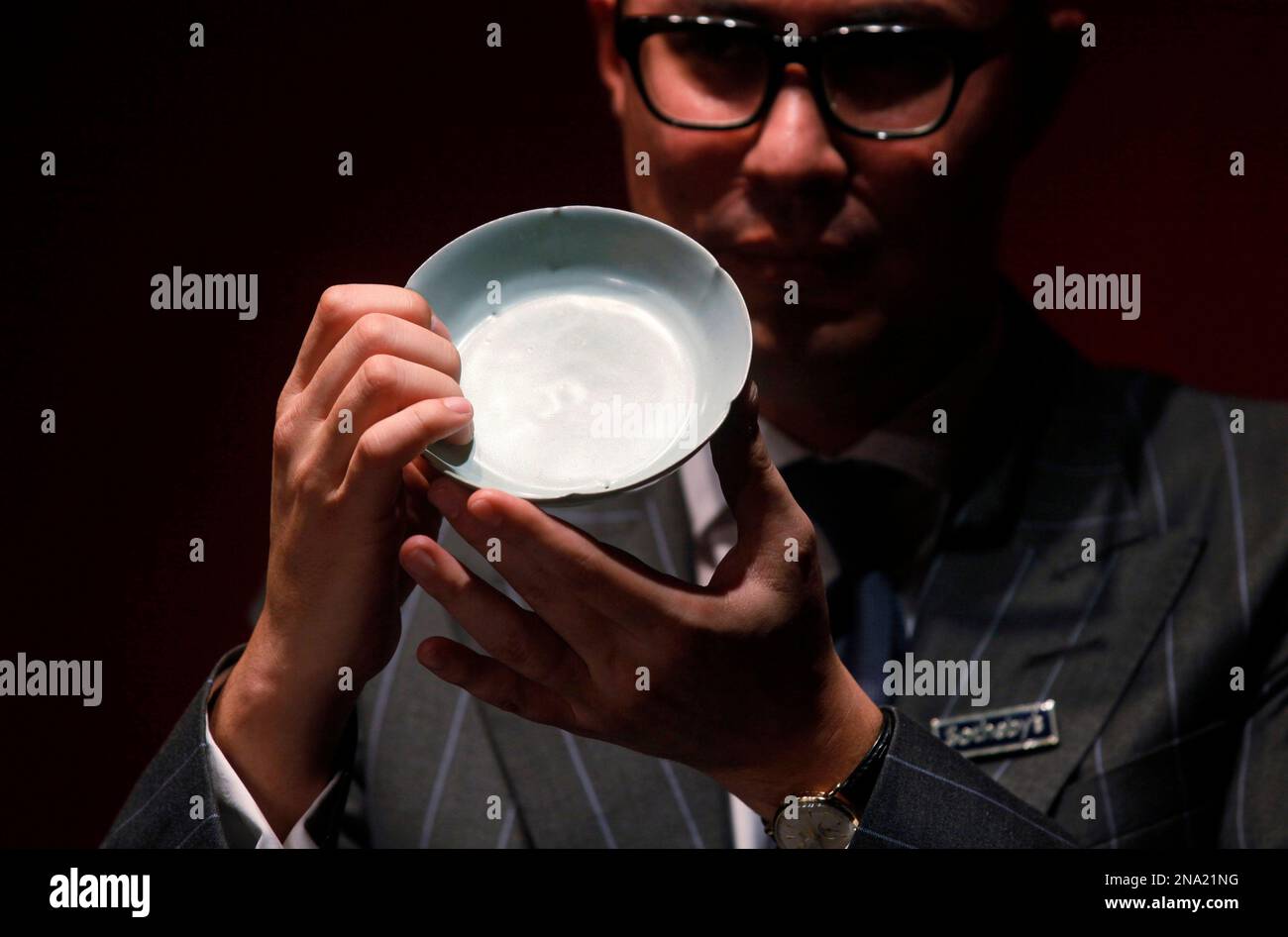 Nicolas Chow, Sotheby’s Asia Deputy Chairman, holds the Chinese Song ...