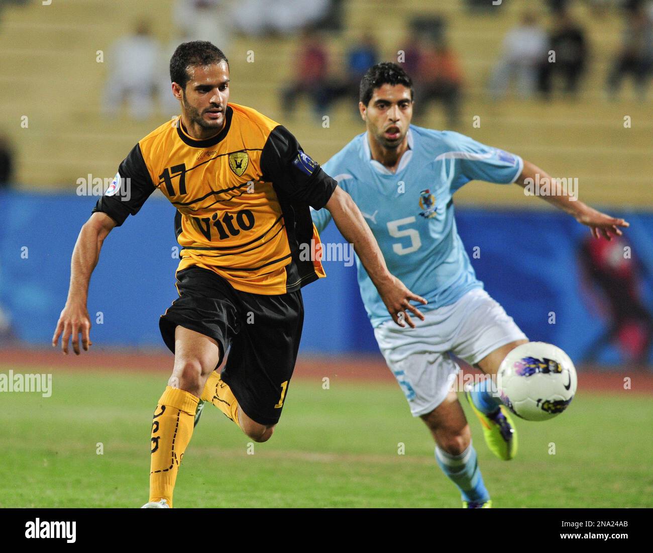 Al Qadsiya Kuwaiti Club striker Bader Al Motawa, left, in action with ...
