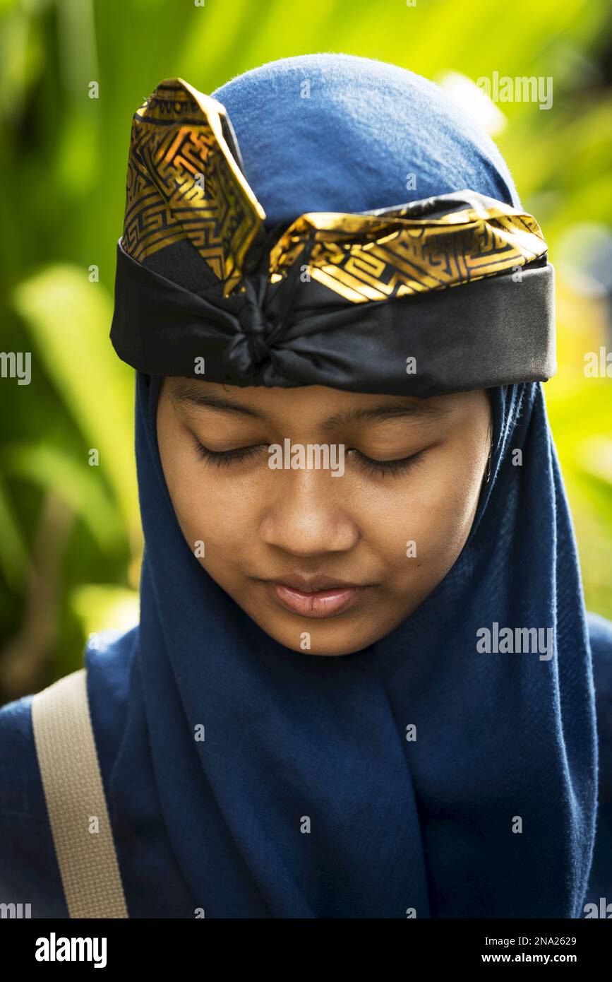 A Young Balinese Woman Poses At A Hindu Ceremony; Bali, Indonesia Stock ...