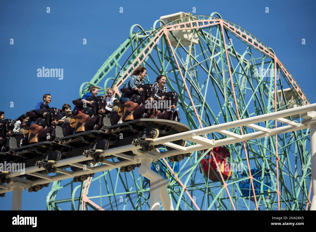 People taking a ride on the Thunderbolt roller coaster in Coney Island ...