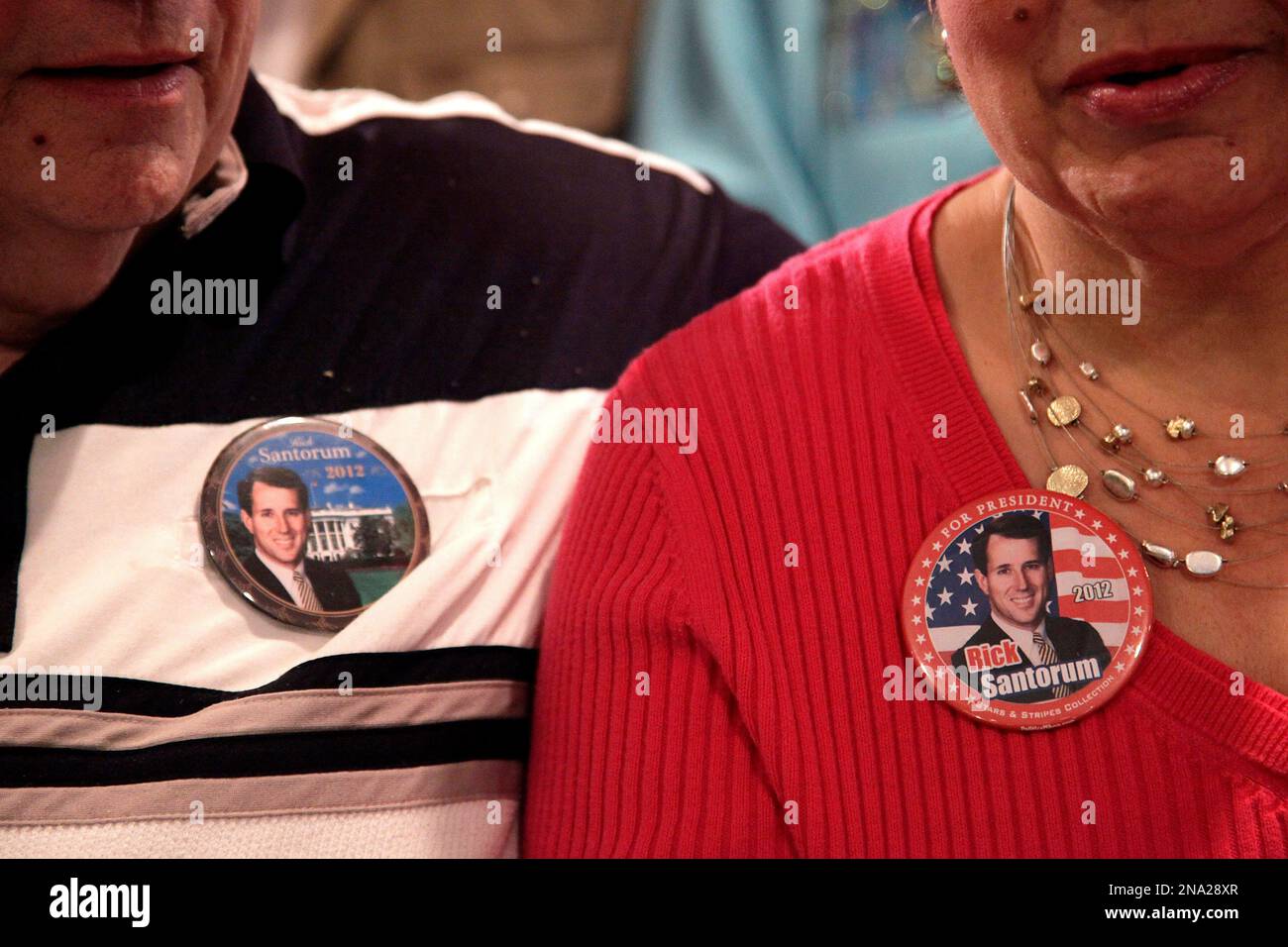 Mary Lou Iannitello, right, and her husband John wear campaign buttons ...