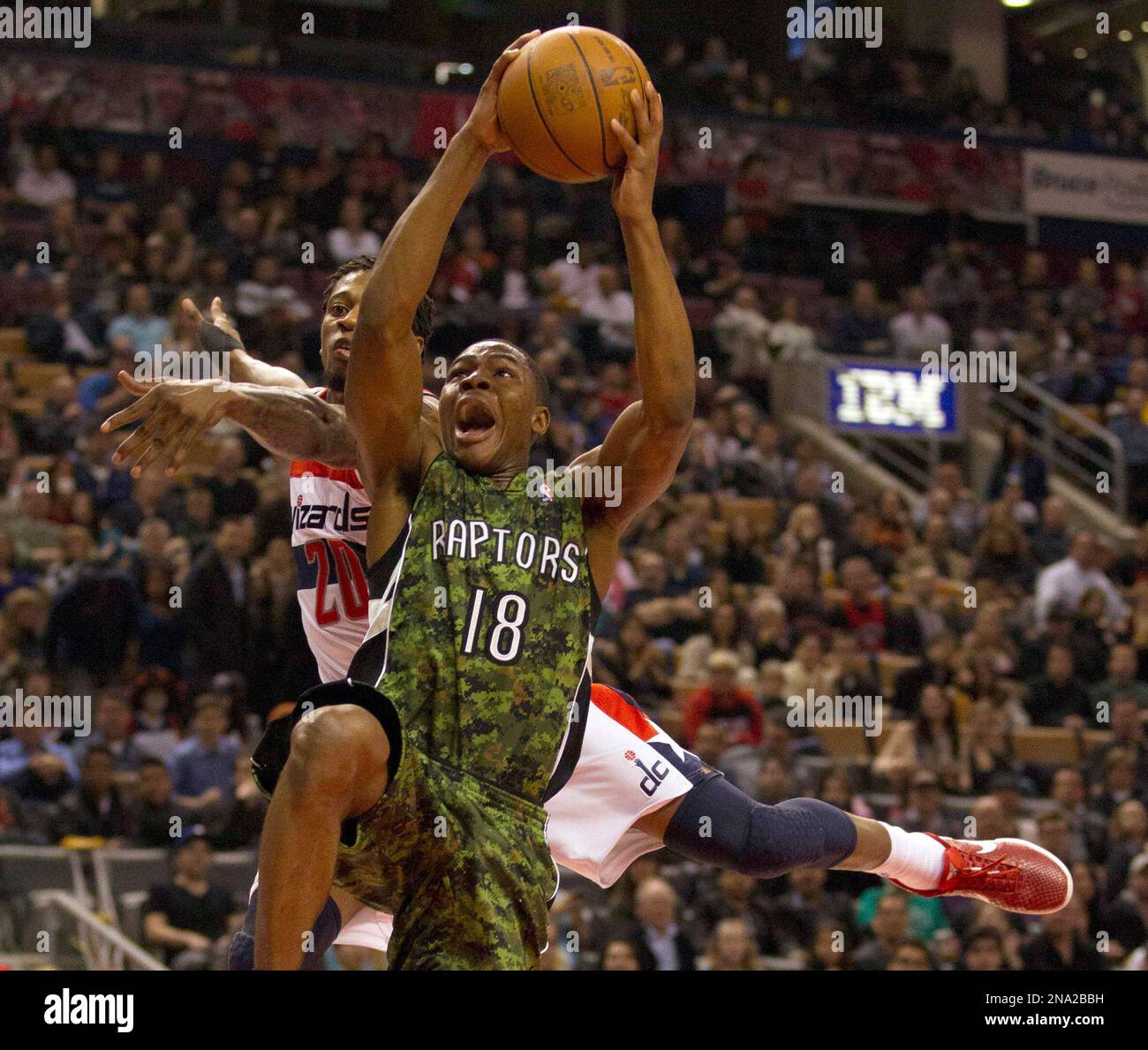 Toronto Raptors guard Ben Uzoh (18) drives to the hoop past Washington ...