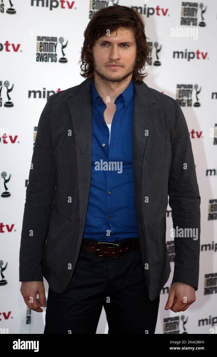 British actor Tom Weston-Jones poses for photographers as helaunches ...