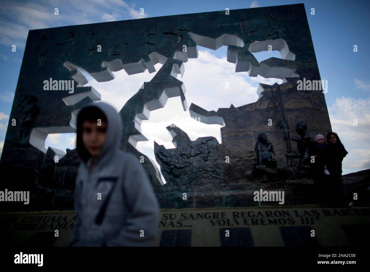 Children play at the Malvinas Falklands war Memorial in Ushuaia ...