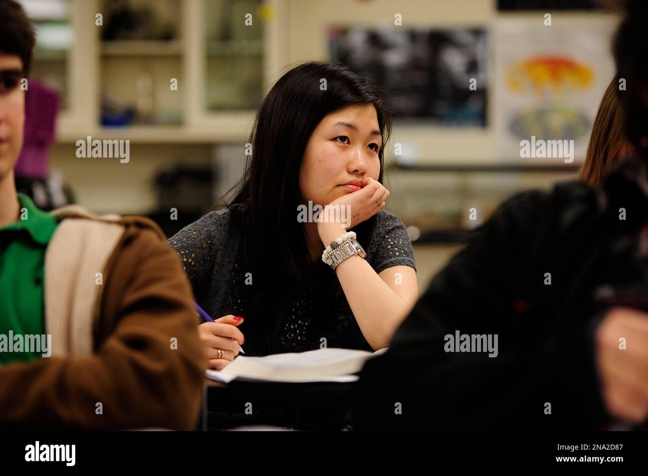In this Feb. 27, 2012, photo, Sally Kim takes notes during a physics ...