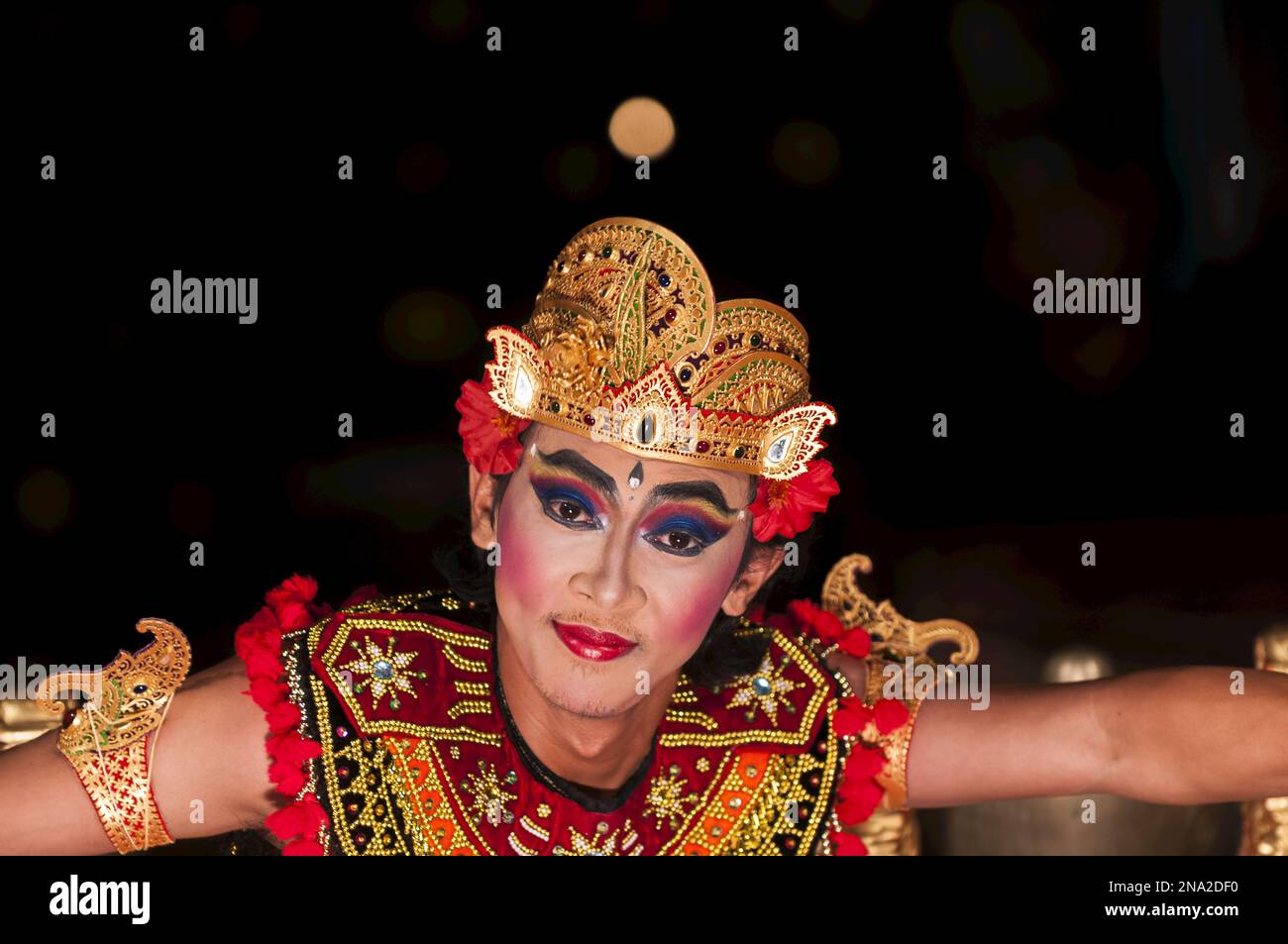 A TRaditonal BAlinese dancer poses at the end of a Dance, Ubud, BAli ...