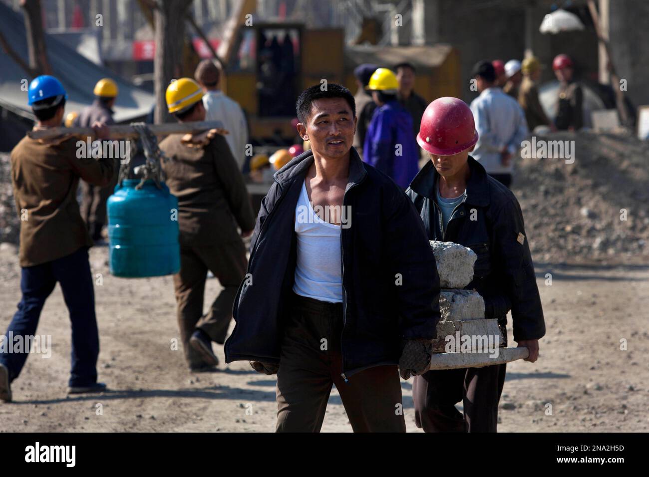 In this Tuesday Oct. 11, 2011 photo, North Korean construction workers ...