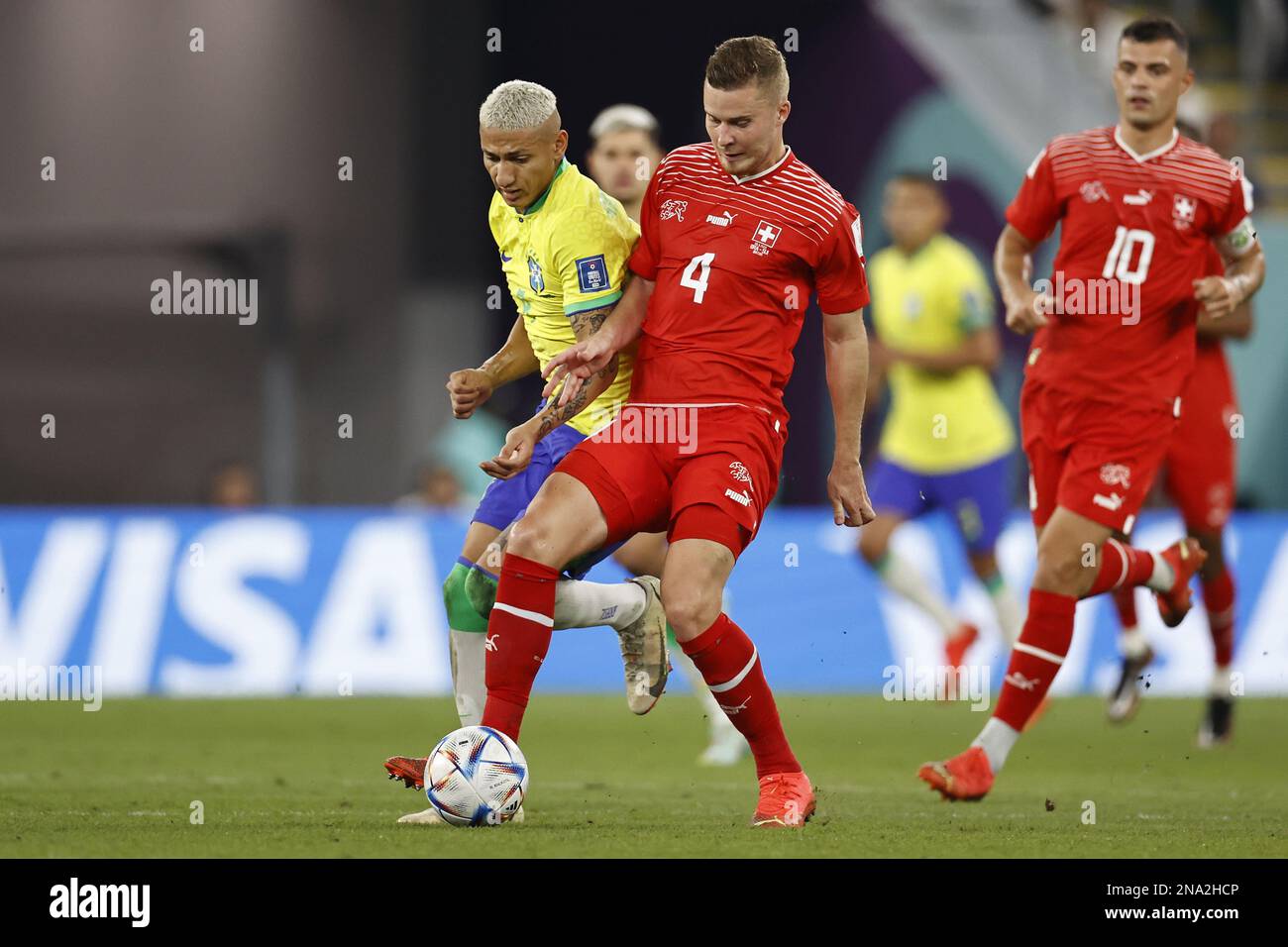 DOHA - (LR) Richarlison of Brazil, Nico Elvedi of Switzerland during ...