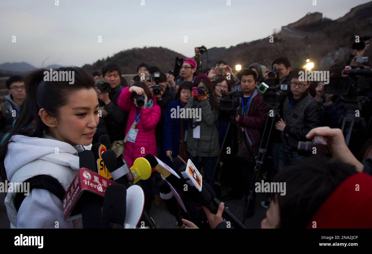 Chinese actress Li BingBing, left, speaks to the media before a mini ...