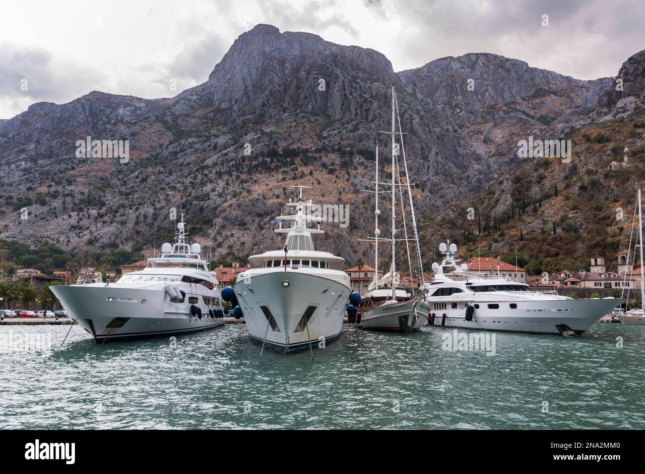 Yachts mooring in the harbour in the Bay of Kotor; Kotor, Montenegro ...