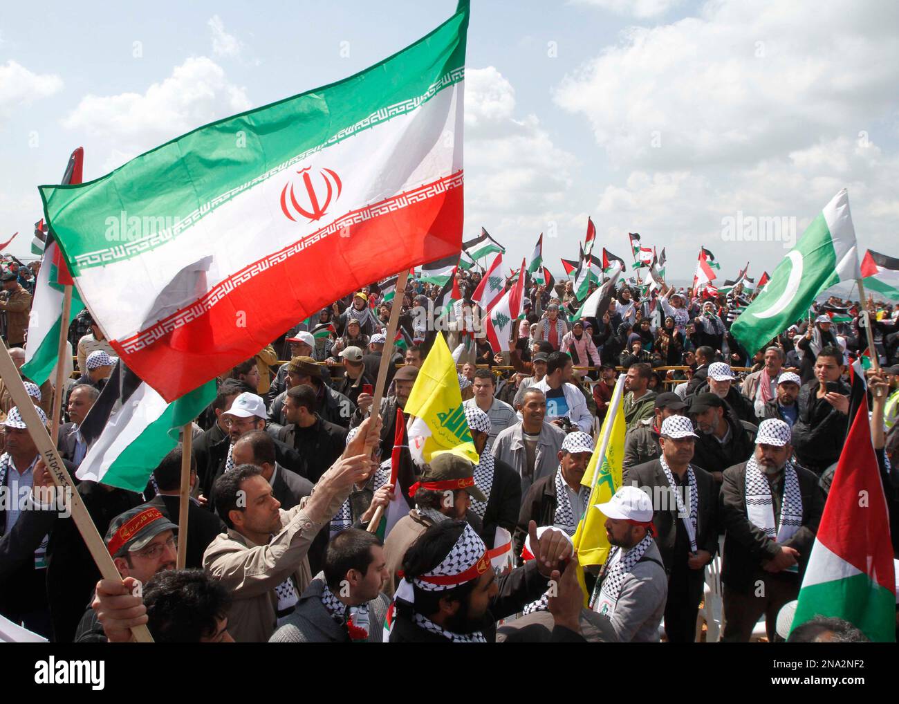 A pro-Palestinians protester waves the Iranian flag during a ...
