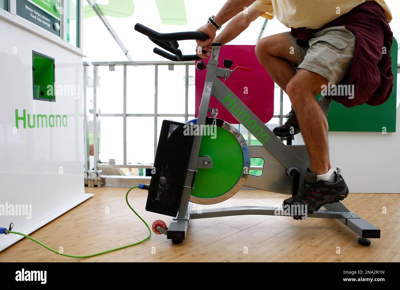 A golf fan takes a ride on a 'Hydration Station' bike at the Humana ...