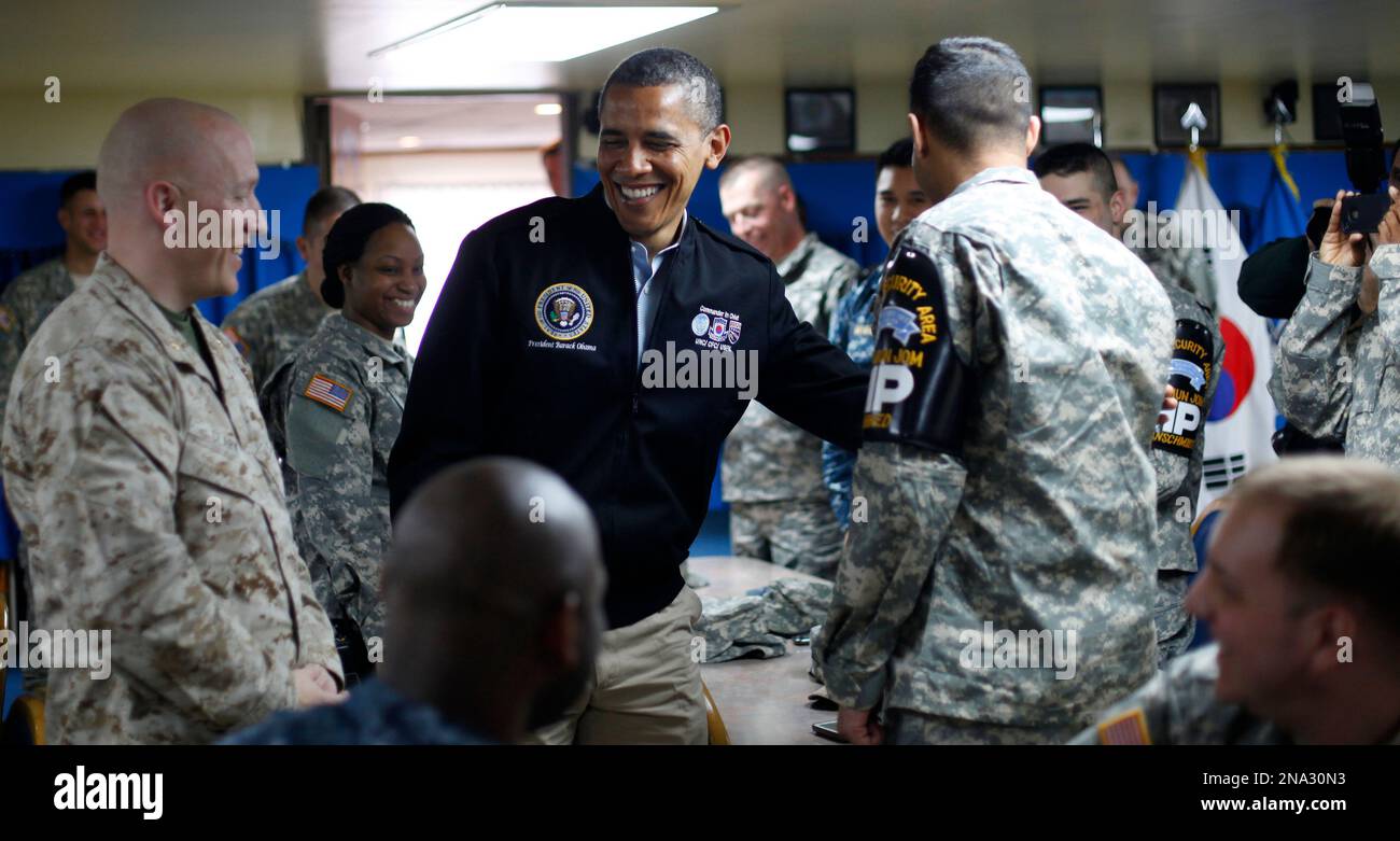 US President Barack Obama meets with troops at the dining hall at Camp ...