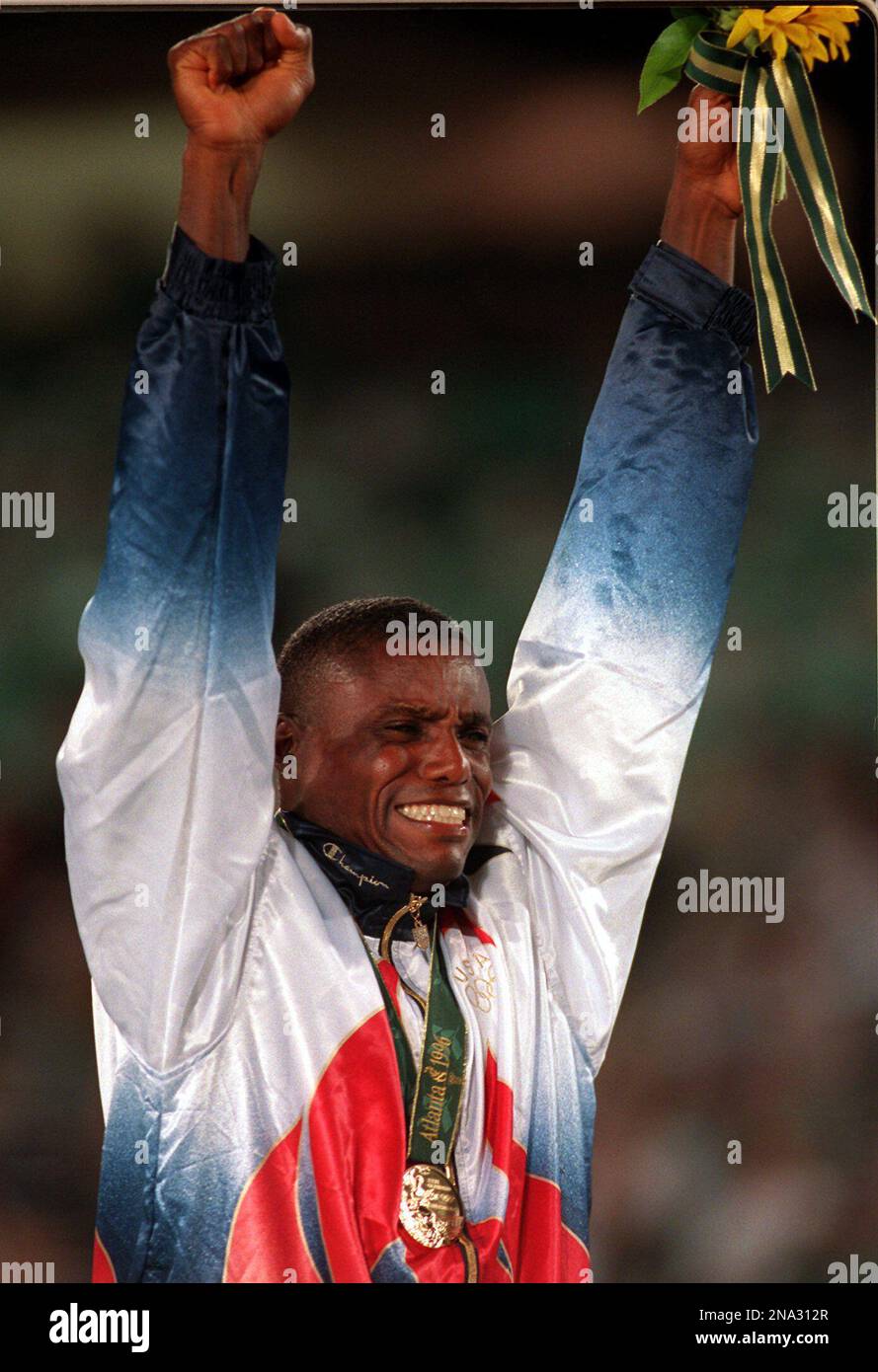FILE - In this July 29, 1996 file photo, gold medalist Carl Lewis ...