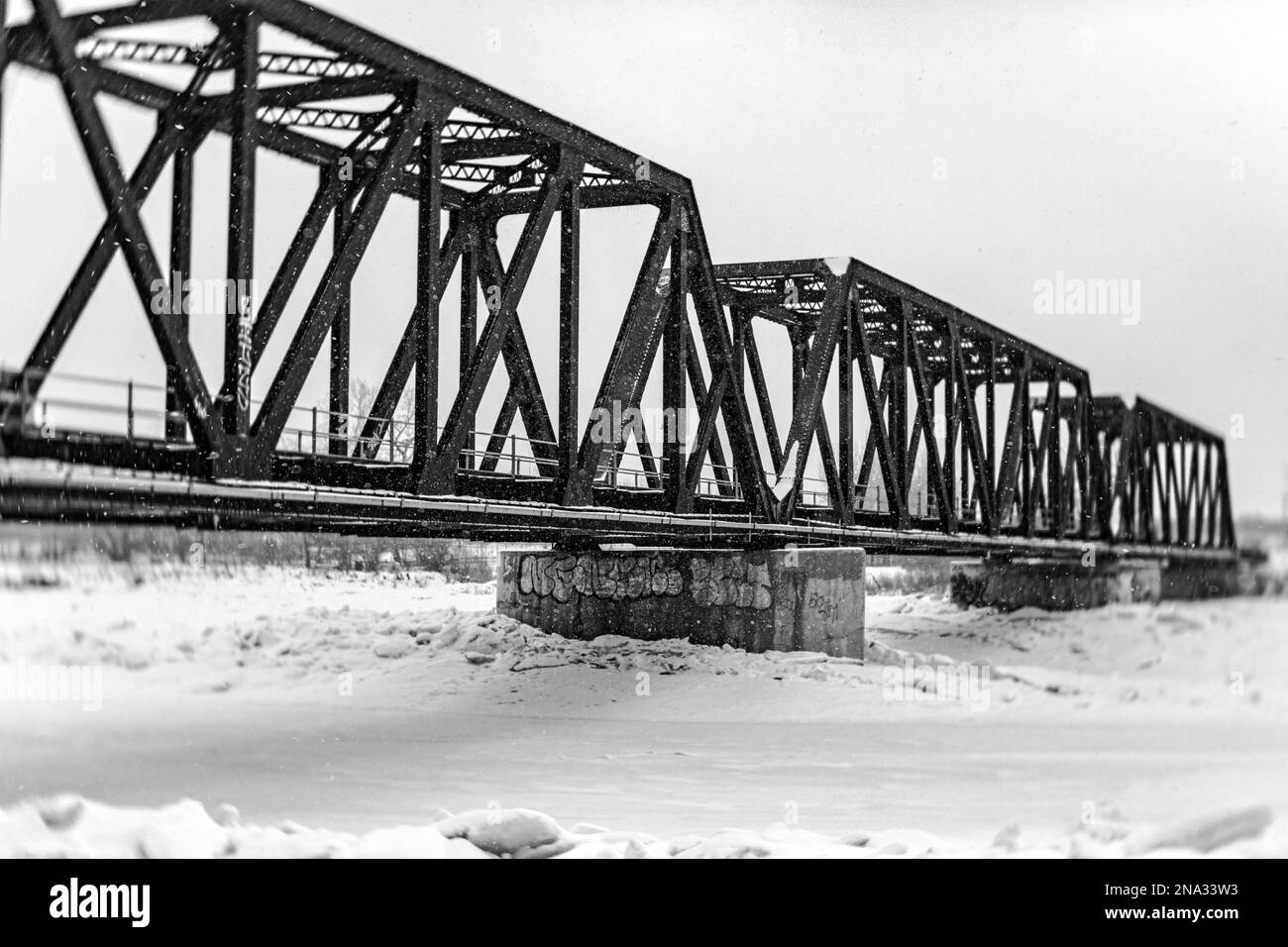 old steel train bridge in the snowstorm, black and white image Stock ...