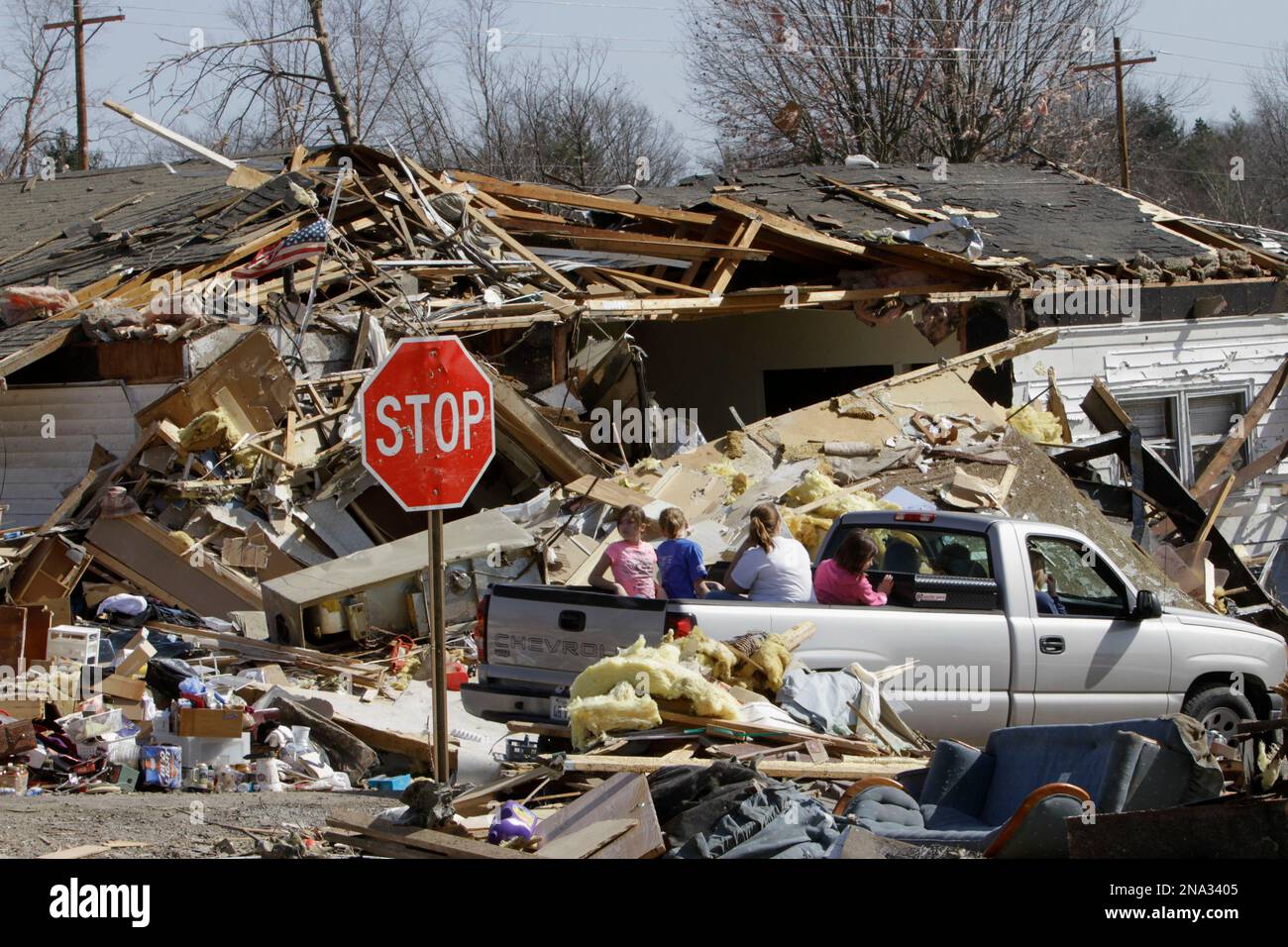 After a tornado the day before, family members and friends help salvage ...