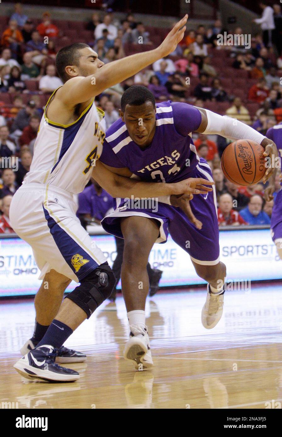 Pickerington's Taco Charlton, right, drives against Toledo Whitmer's ...