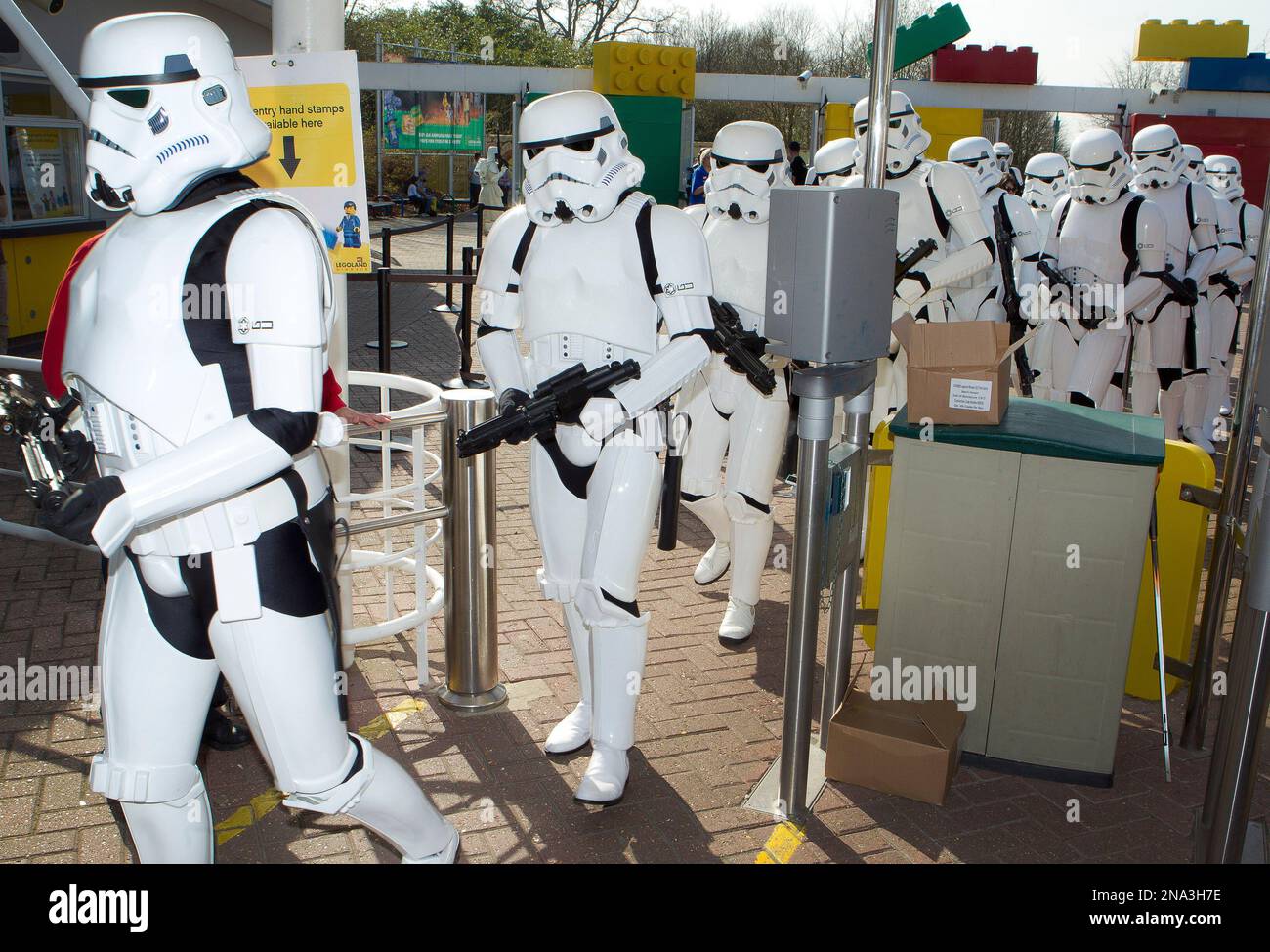 Imperial Stormtroopers go through turnstiles at the Star Wars Lego Land ...