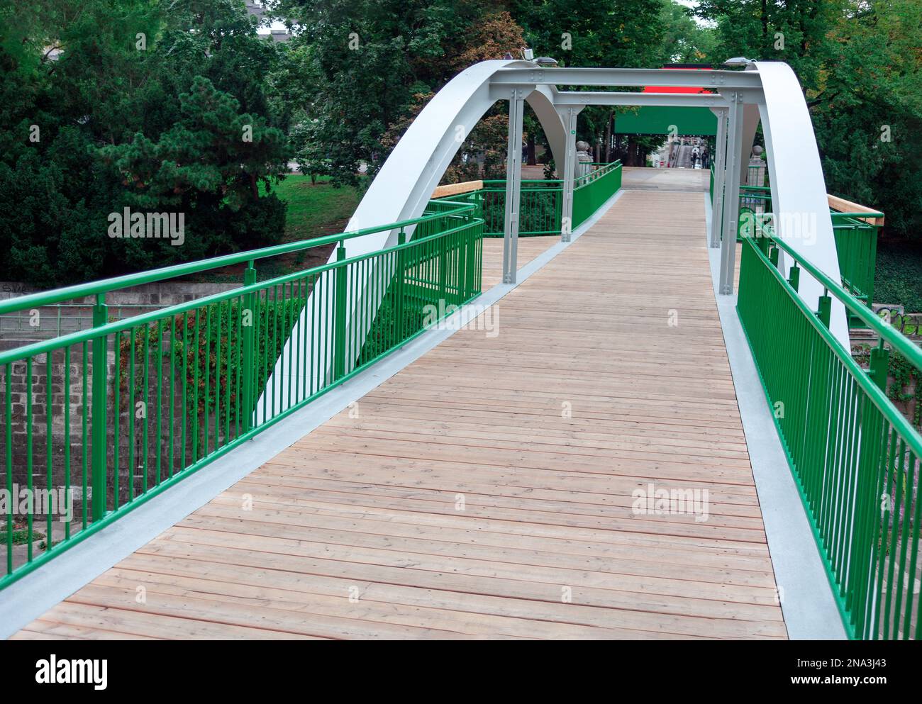 Pedestrian bridge with wooden floor . Footbridge in park of Vienna ...