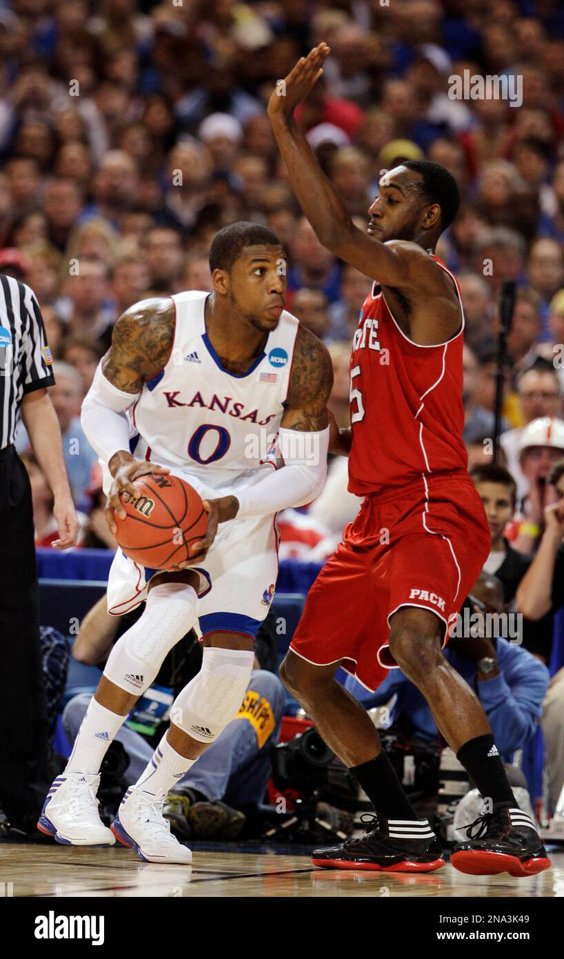Kansas Jayhawks' Thomas Robinson (0) is defended by North Carolina ...