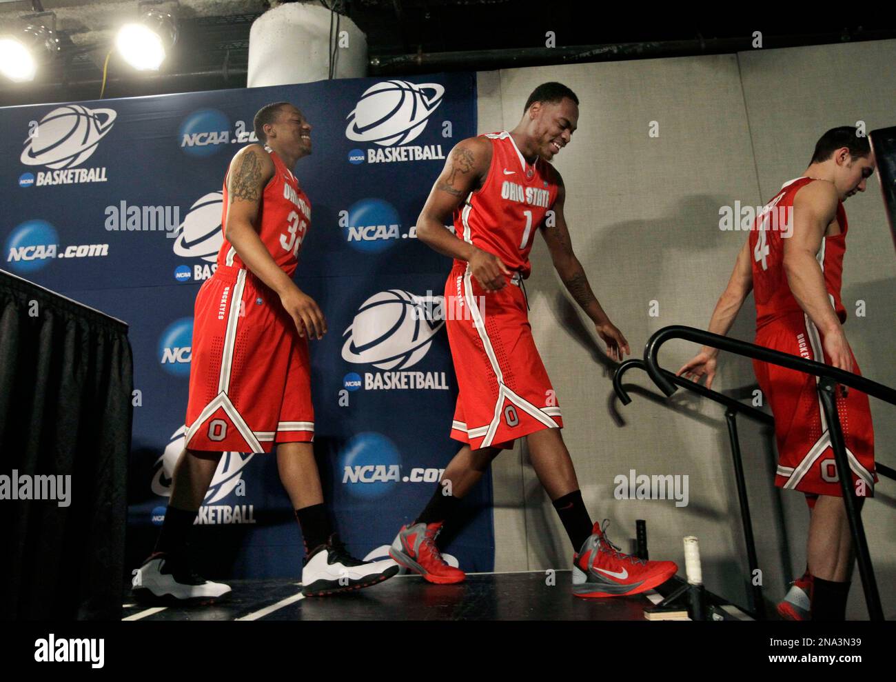Ohio State players, from left, Lenzelle Smith, Jr., Deshaun Thomas and Aaron Craft leave a news ...