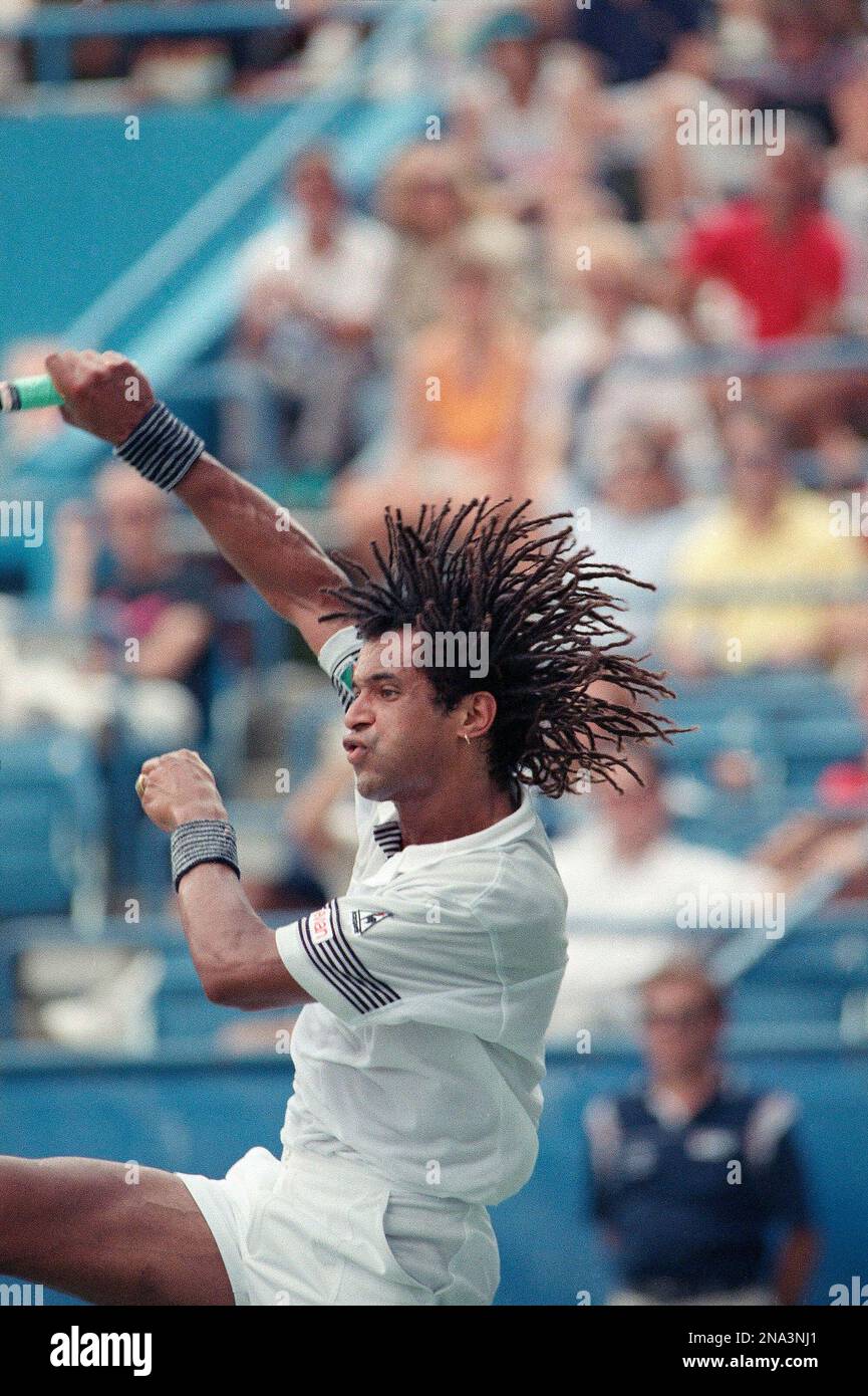 France’s Yannick Noah’s hair flies as he hits an overhead shot in the U ...