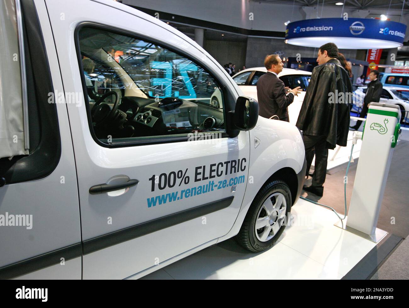 Visitors look at a Kangoo Renault electric car, showing at the EVER ...