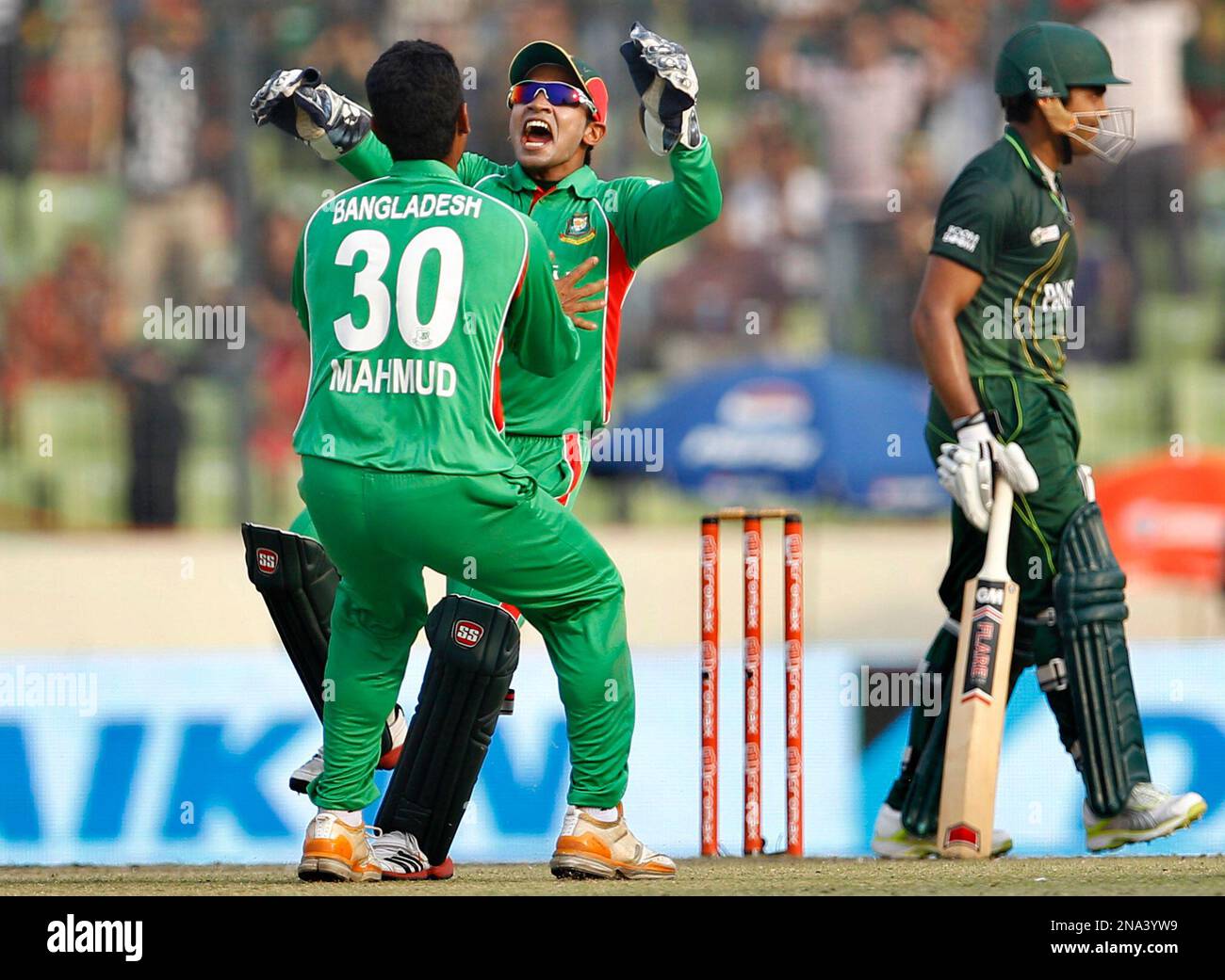 Bangladesh's captain Mushfiqur Rahim, center, celebrates with teammate ...
