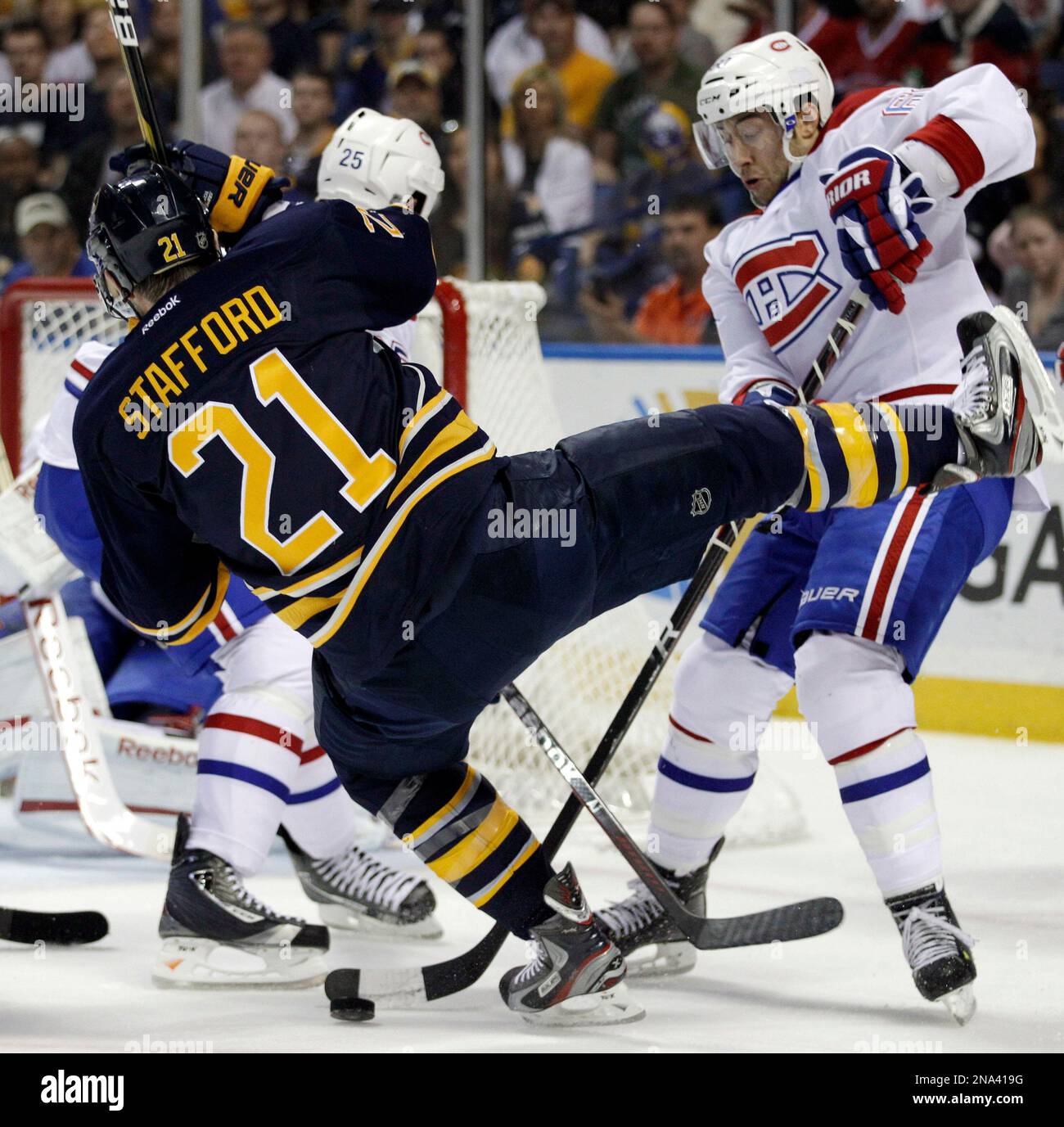 Buffalo Sabres' Drew Stafford (21) battles for the puck with Montreal ...