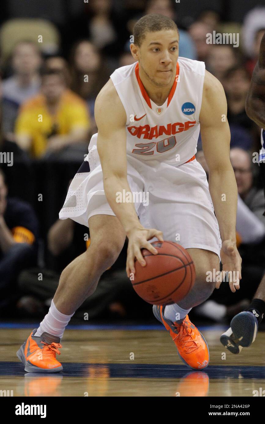 Syracuse's Brandon Triche (20) looks to pass during an East Regional ...