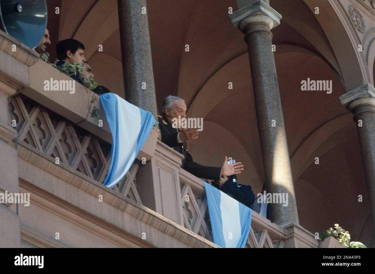 Argentina's President Gen. Leopoldo Galtieri, waves to the crowd of ...