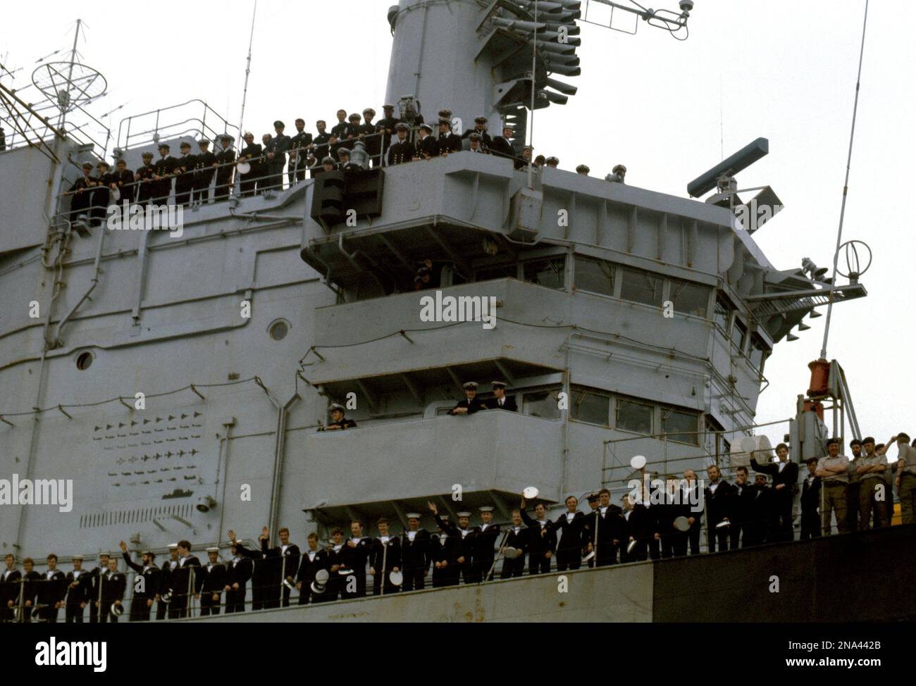 The crew of the Task Force flagship, the aircraft carrier HMS Hermes ...